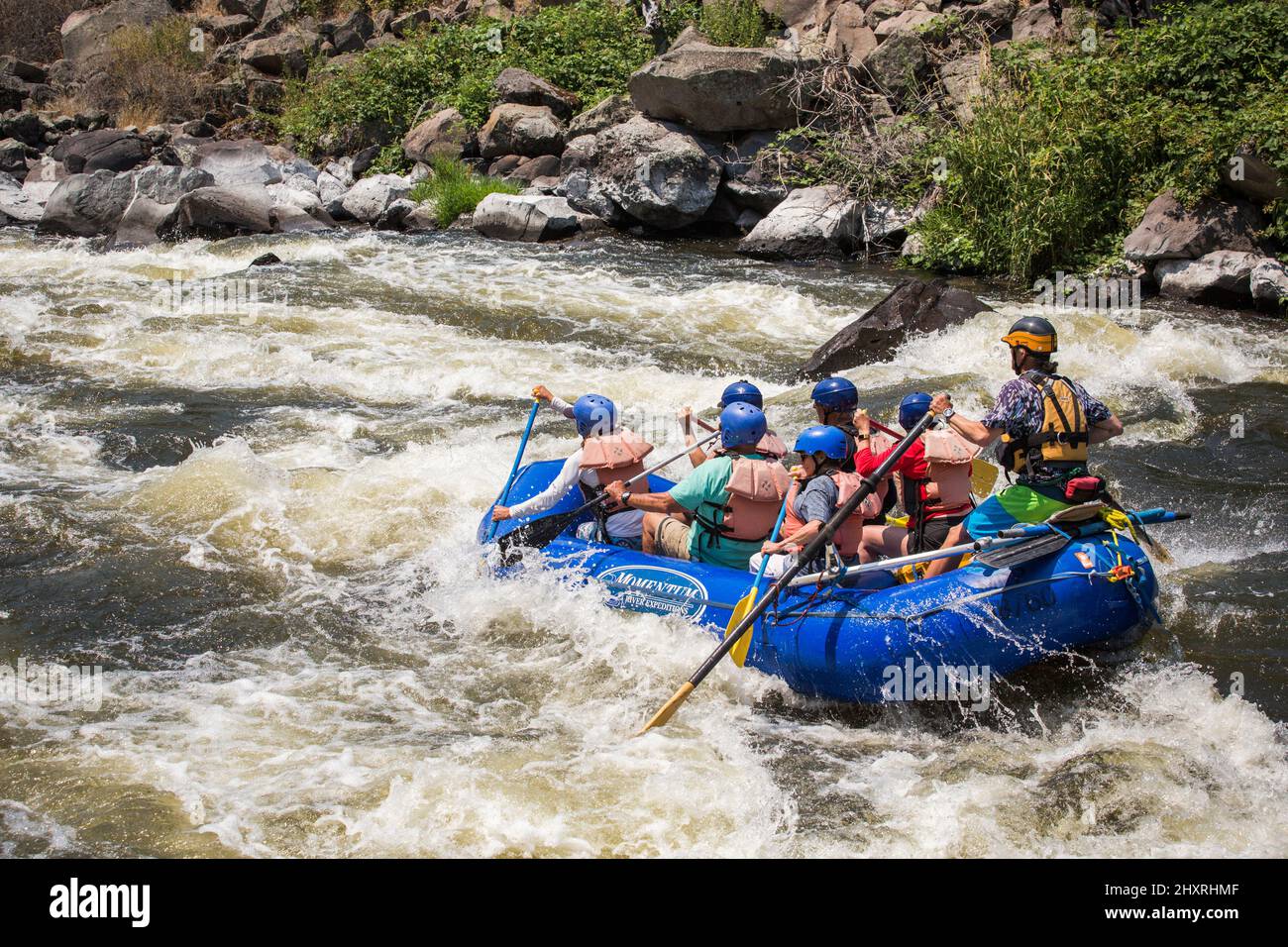 A raft rides into big whitewater Stock Photo - Alamy