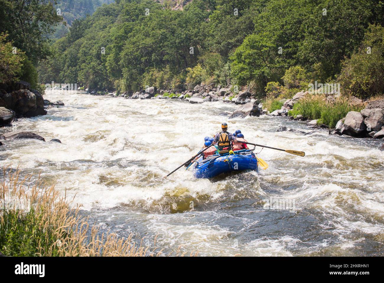 A raft rides into big whitewater Stock Photo - Alamy