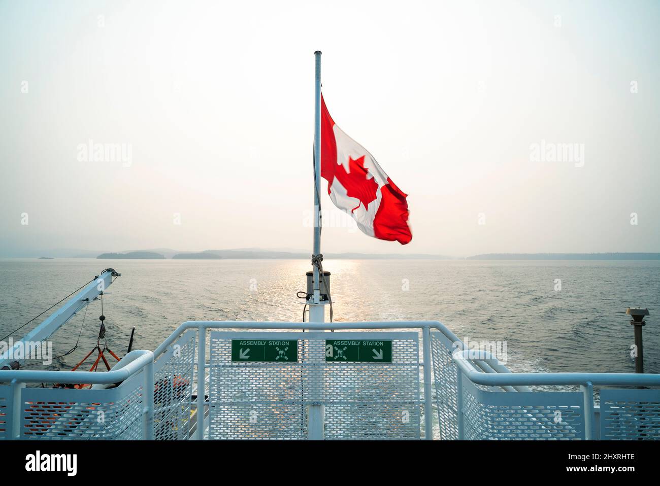 Canadian flag waves at stern of ferry boat over water Stock Photo - Alamy