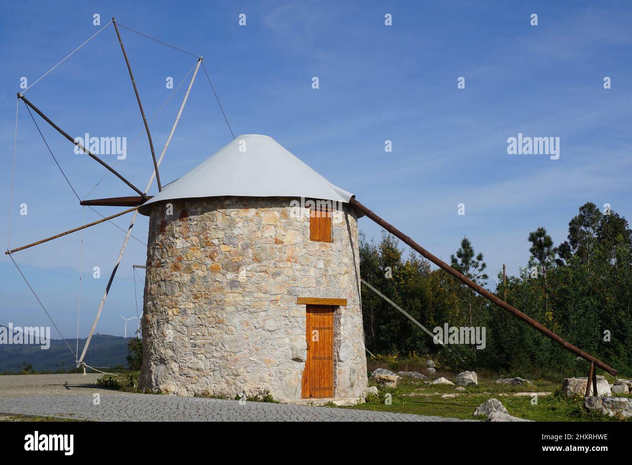 Rustic windmill on top of mountain Stock Photo - Alamy