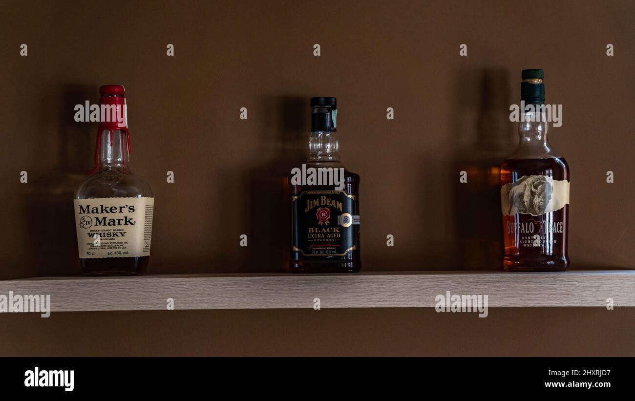Three different bourbon whiskeys on the same shelf Stock Photo - Alamy