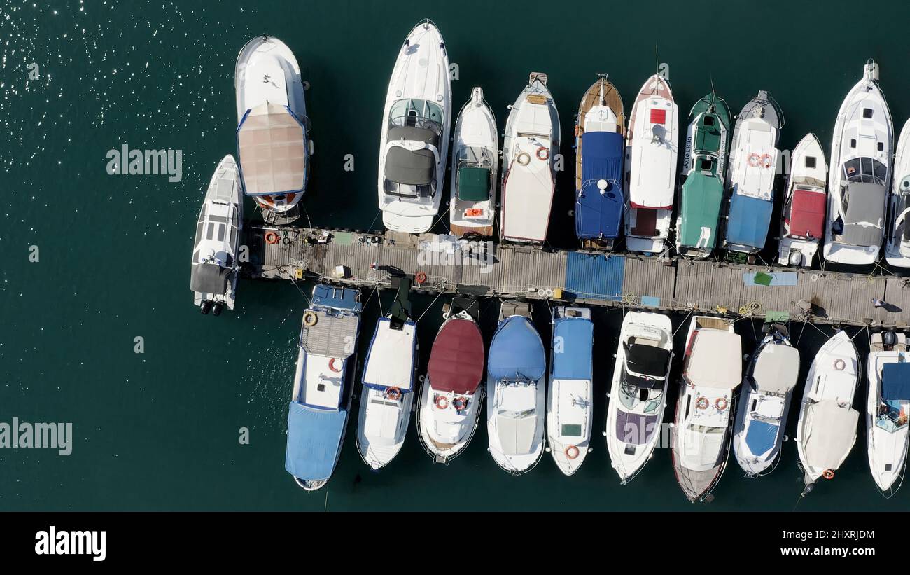 Aerial top view of the yachting bay and turquoise calm water surface ...