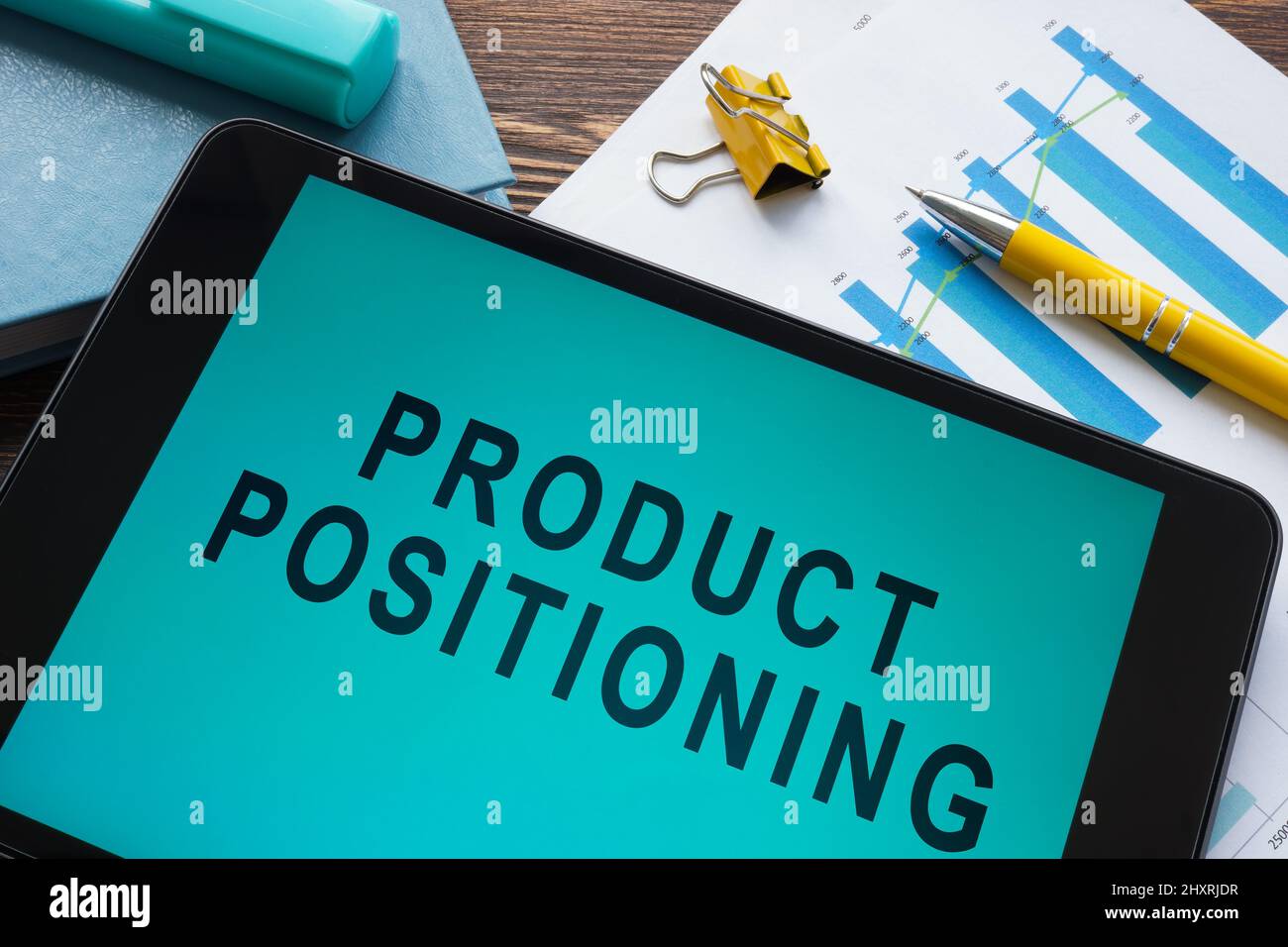 Product positioning words on the tablet screen and papers Stock Photo ...