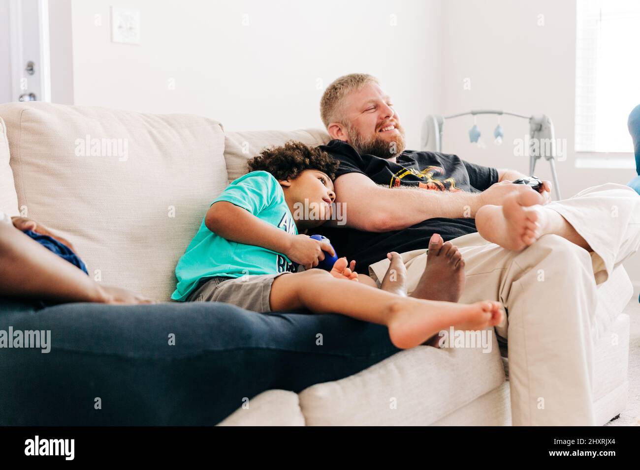 Loving moment of happy father playing video games with young son Stock ...