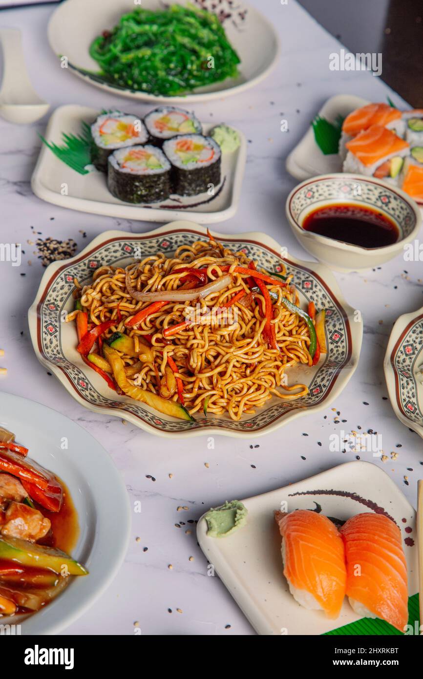Variety of Asian food dishes served on the restaurant table Stock Photo ...