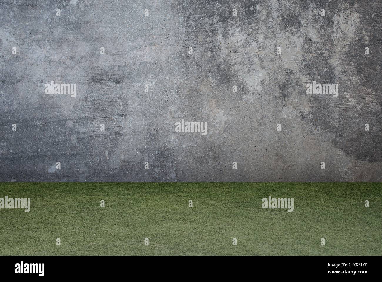 Concrete wall and green grass texture background Stock Photo - Alamy