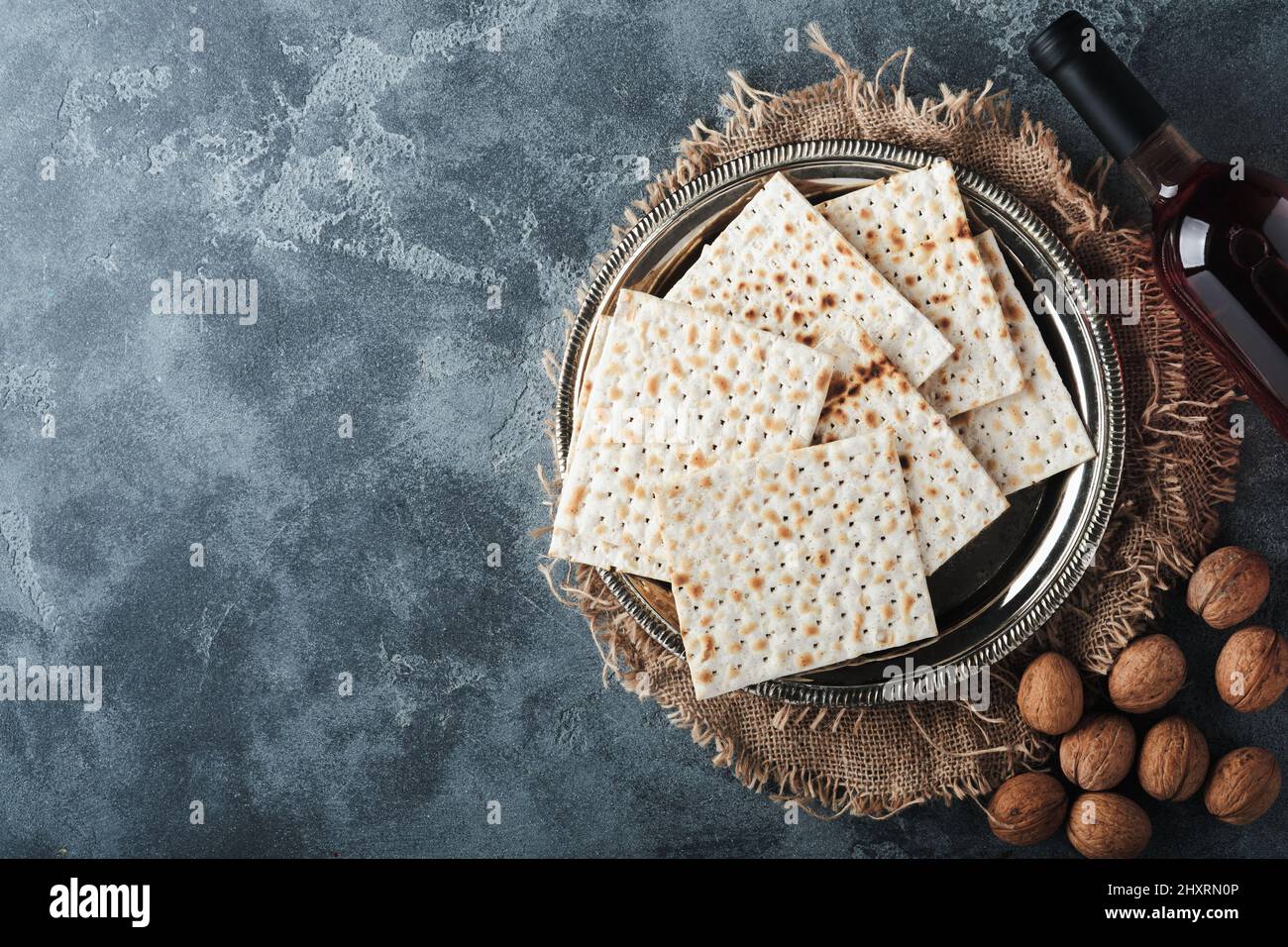 Passover celebration concept. Matzah, red kosher and walnut ...