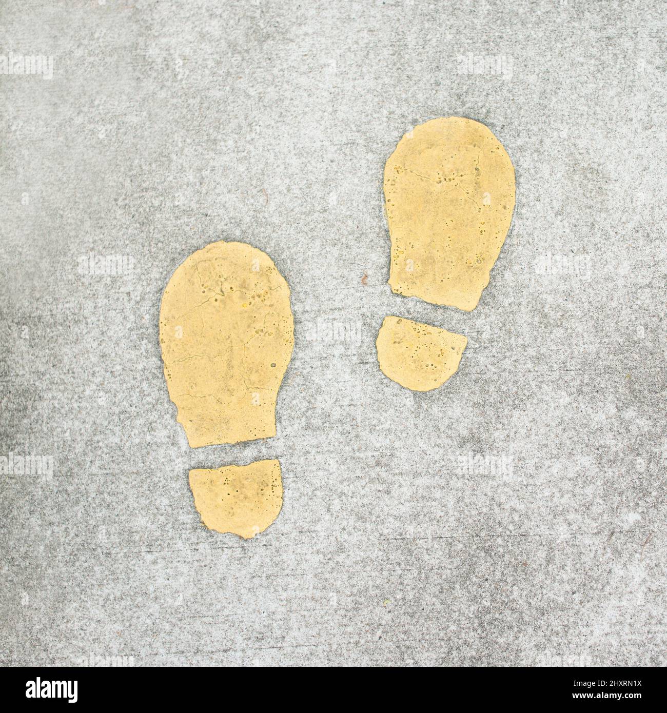 Footprint painted on the pavement, footpath, sidewalk Stock Photo - Alamy