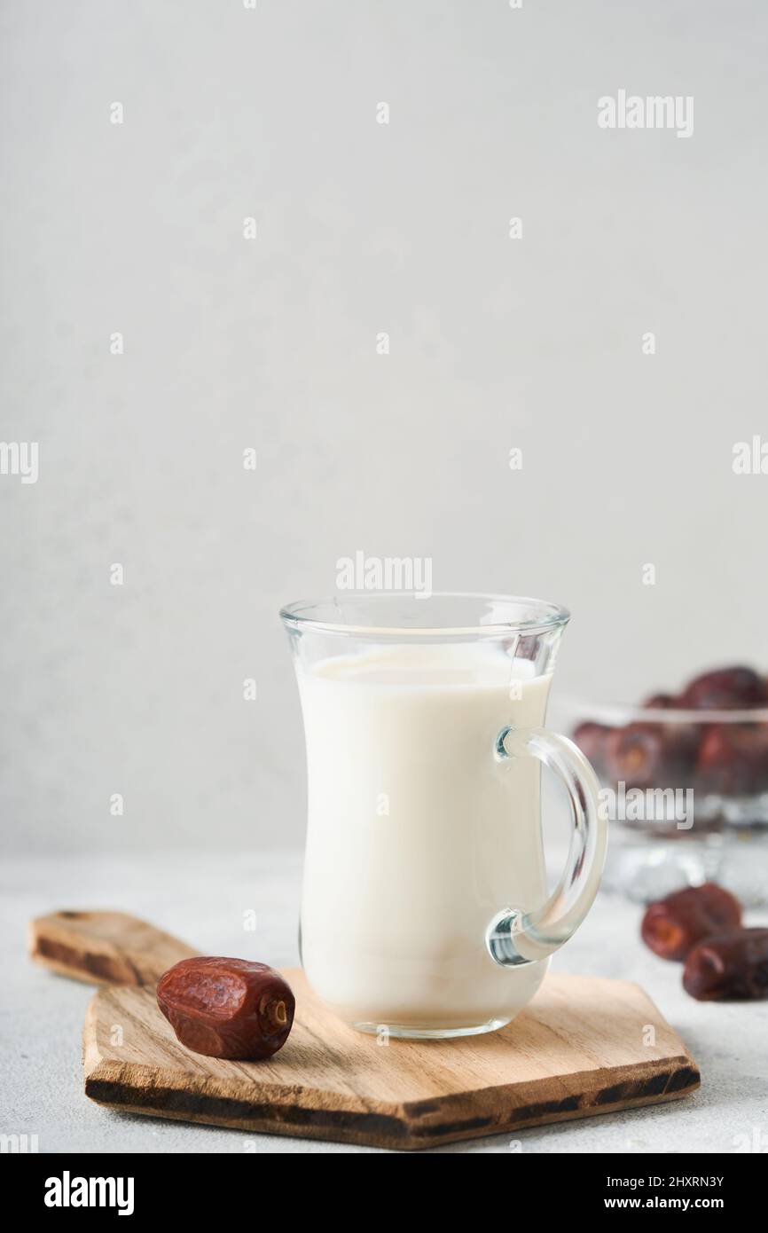 Ramadan Kareem food and drinks. Plate of dates, glass of milk and date ...