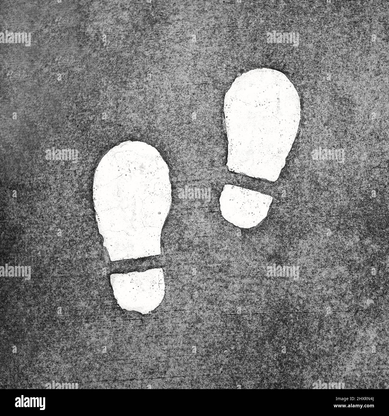 Footprint painted on the pavement, footpath, sidewalk Stock Photo - Alamy