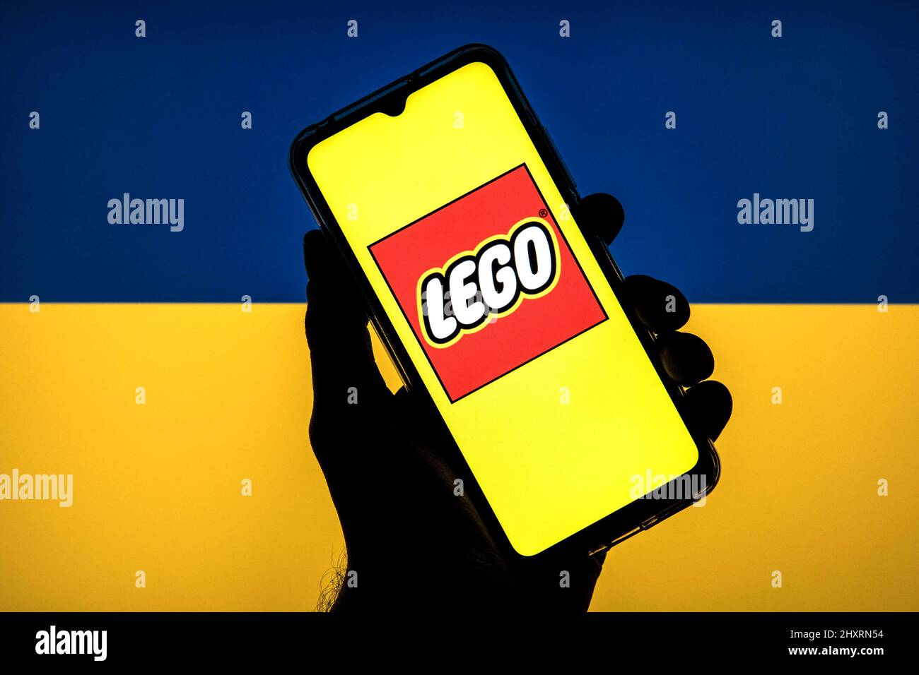 In this photo illustration a Lego logo seen displayed on a smartphone ...