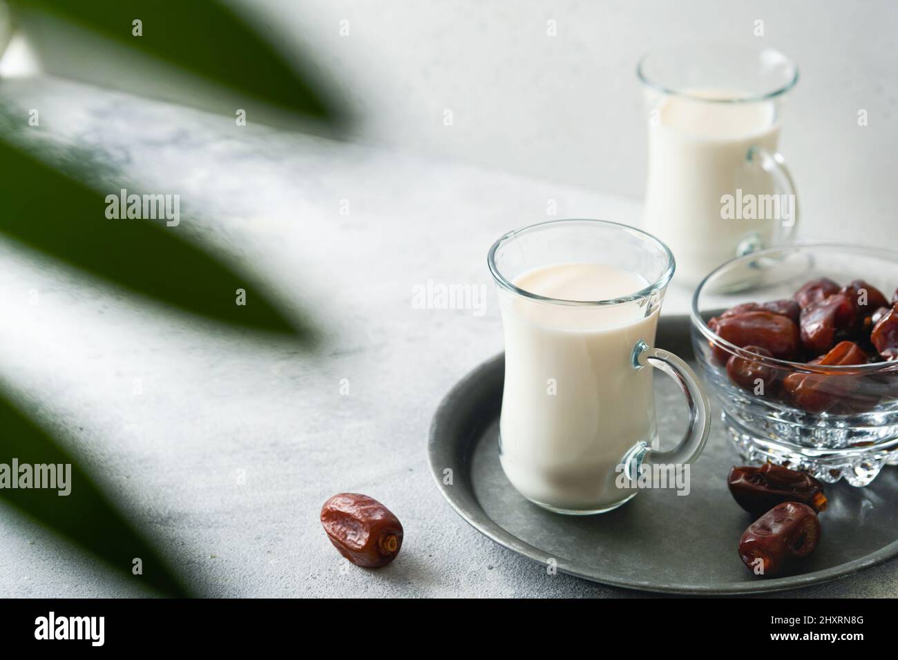 Ramadan Kareem food and drinks. Plate of dates, glass of milk and date ...