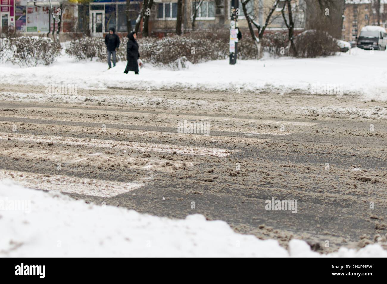 Snow covered pedestrian crossing on the road Stock Photo - Alamy