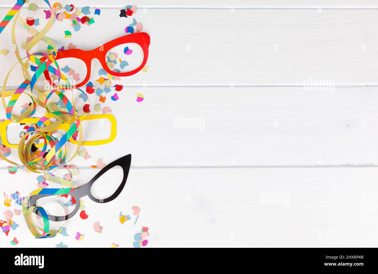 Carnival party background with confetti and glasses Stock Photo - Alamy