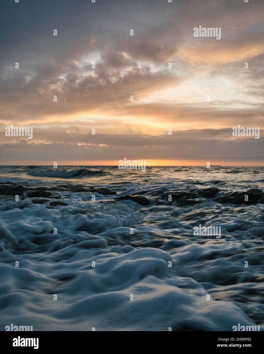 Mesmerizing view of a beautiful seascape at scenic sunset in isle Wight ...