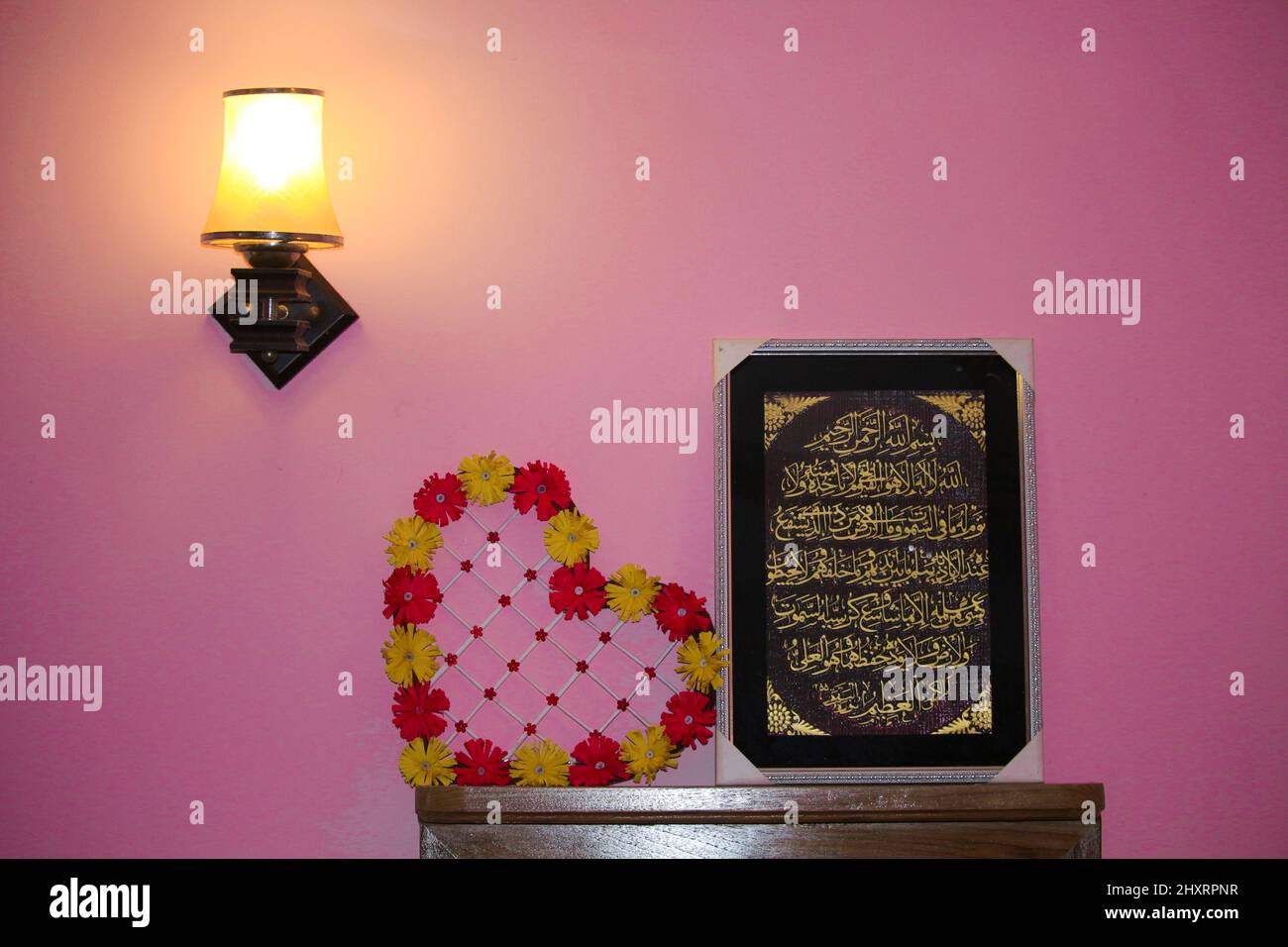 Bedside table overhead lamp that casts light & shadow on the wal Stock ...