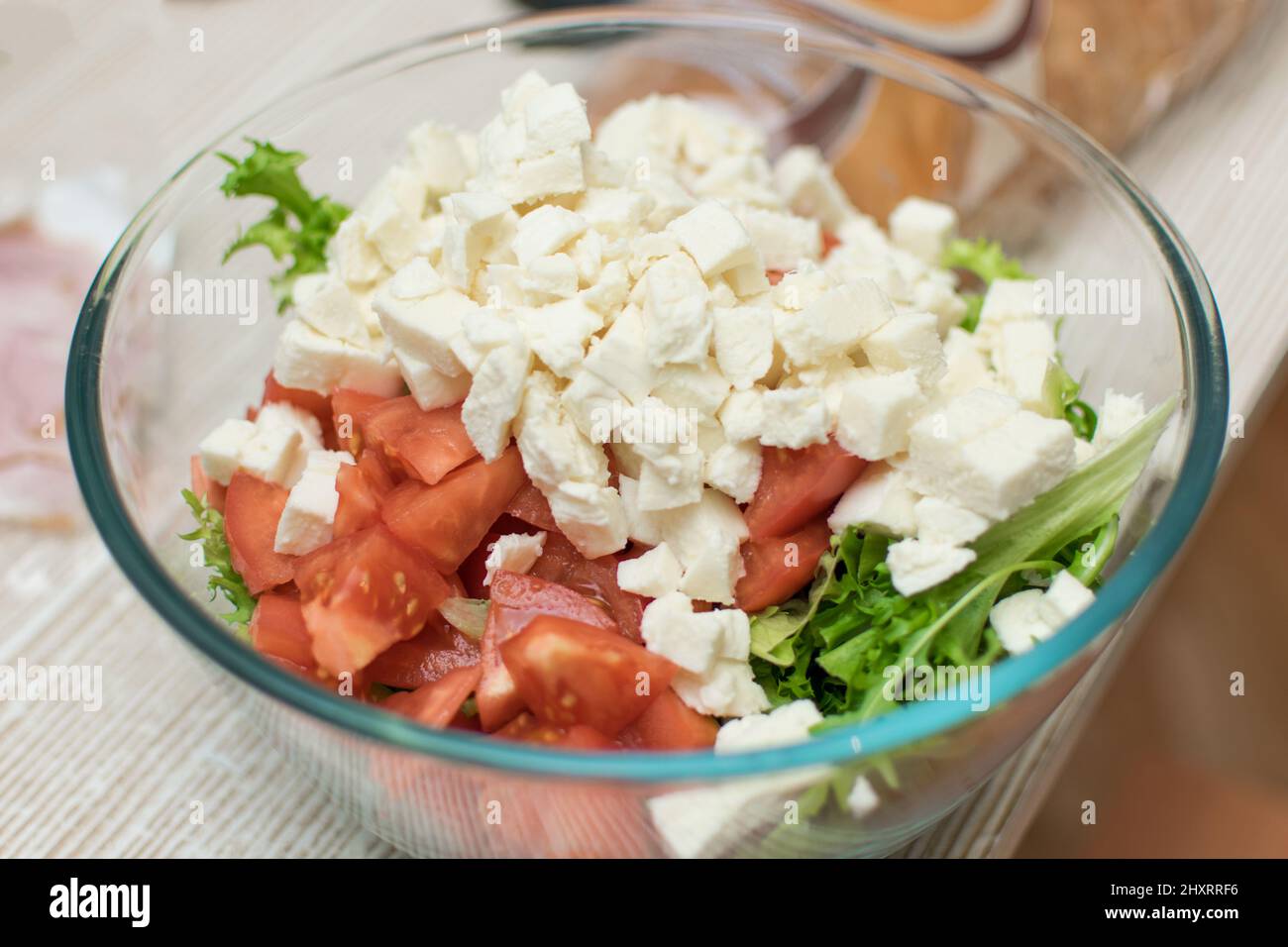 Cooking salad from fresh vegetables and cheese Stock Photo - Alamy