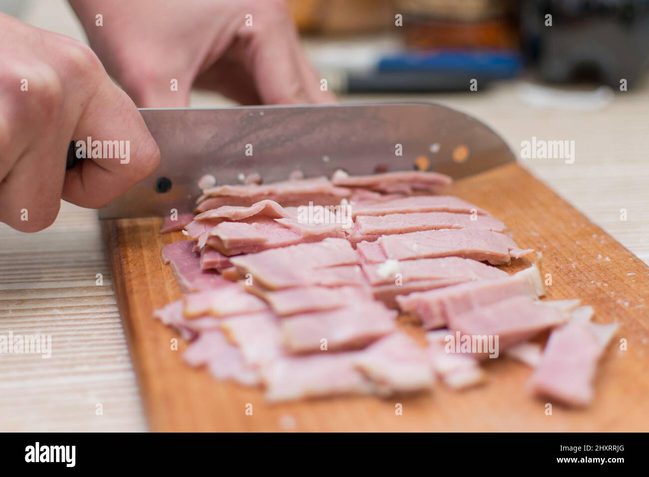 Woman cutting tasty ham hi-res stock photography and images - Alamy