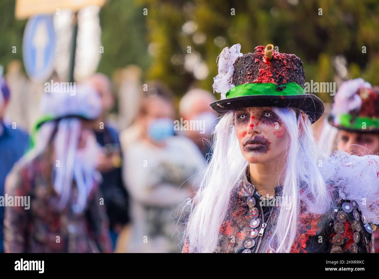 Selective focus of a woman in costume and makeup performing in the ...