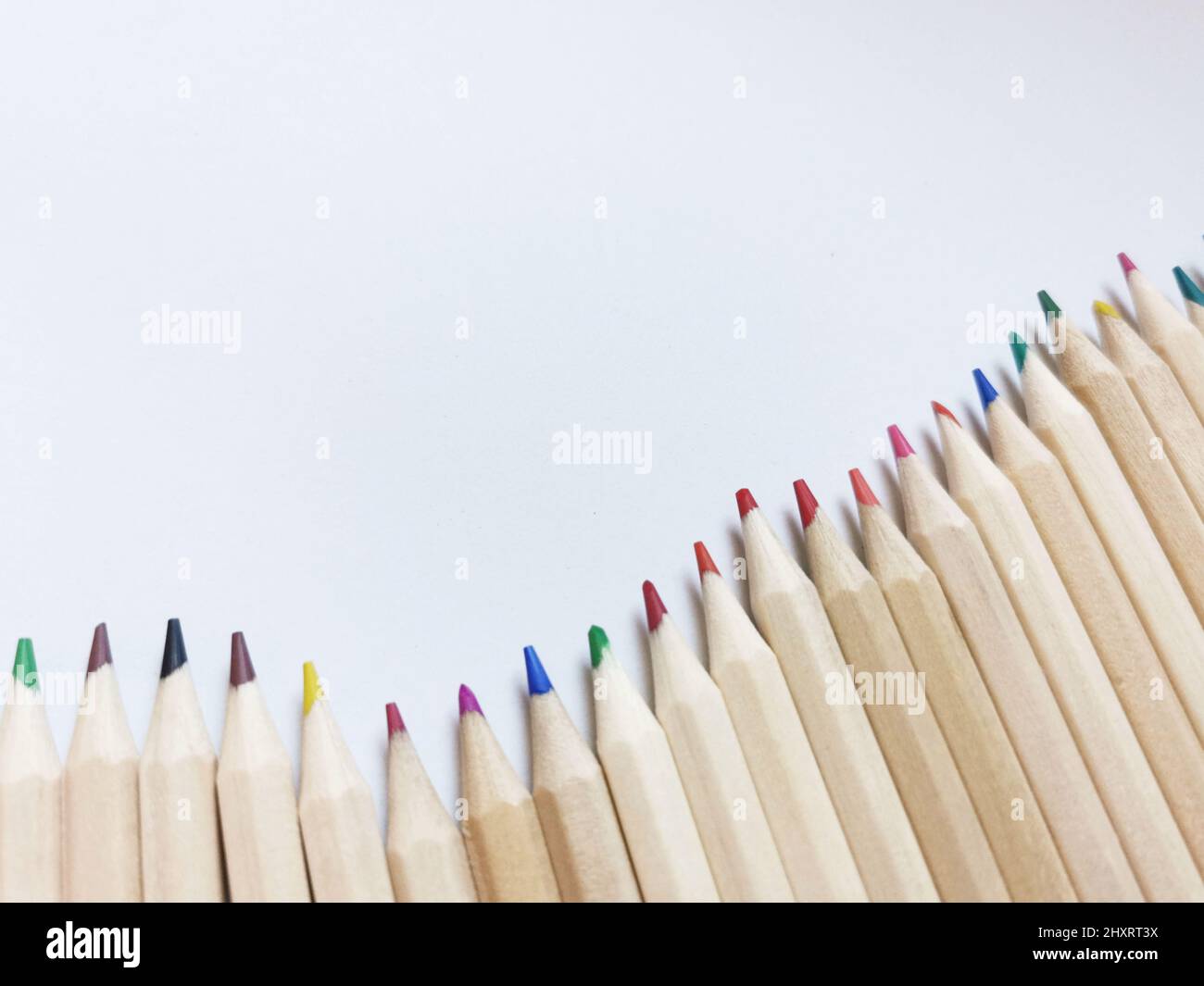 Set of colored wooden pencils on a white background Stock Photo - Alamy