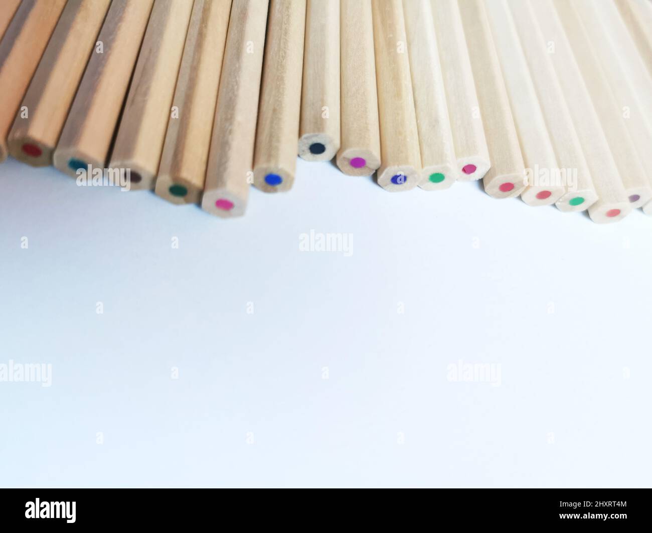 Closeup of a set of colorful pencils on the white paper Stock Photo - Alamy