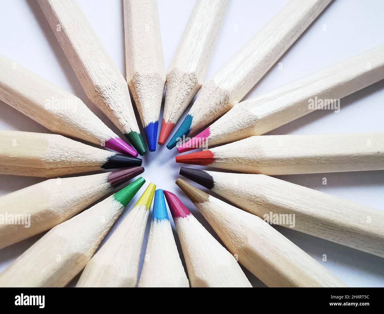 Macro view of sharp color pencils put close to each other on the white ...