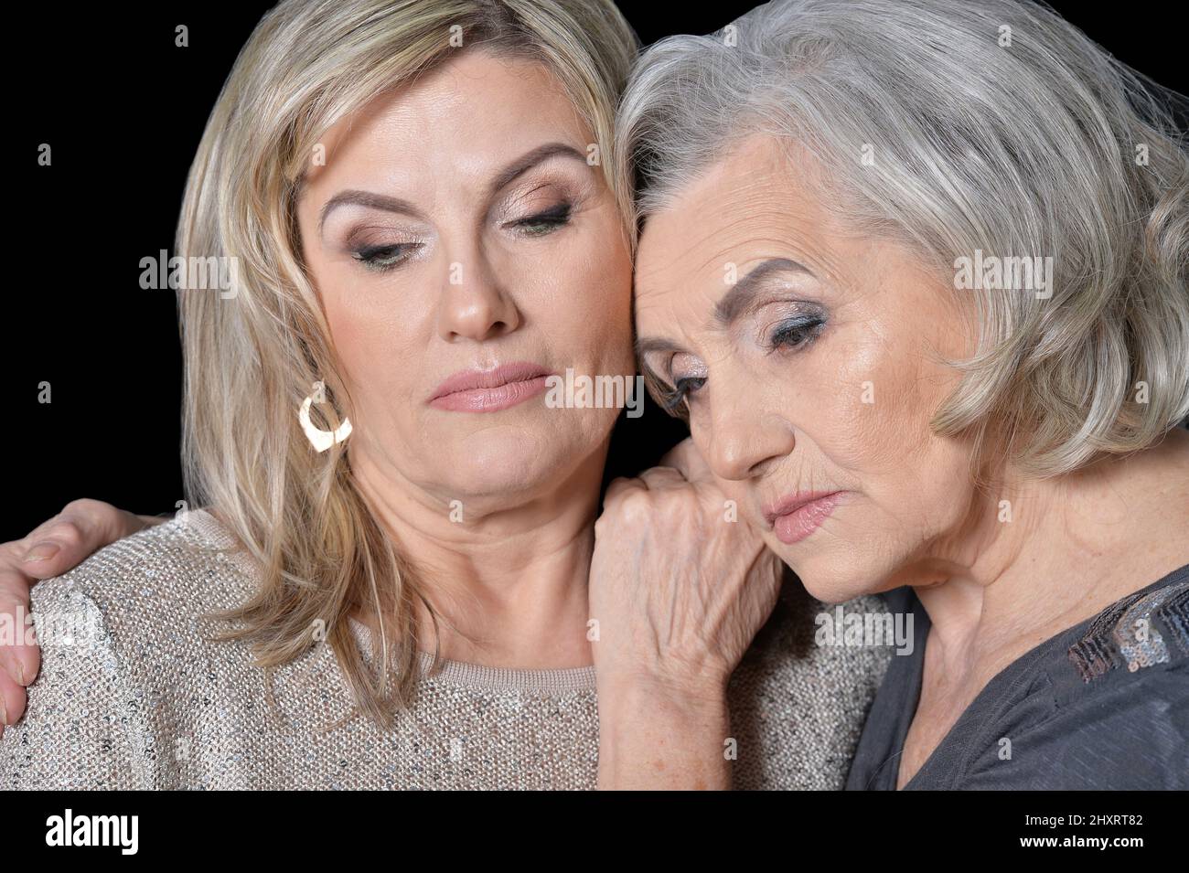 Close up portrait of two sad women posing Stock Photo - Alamy