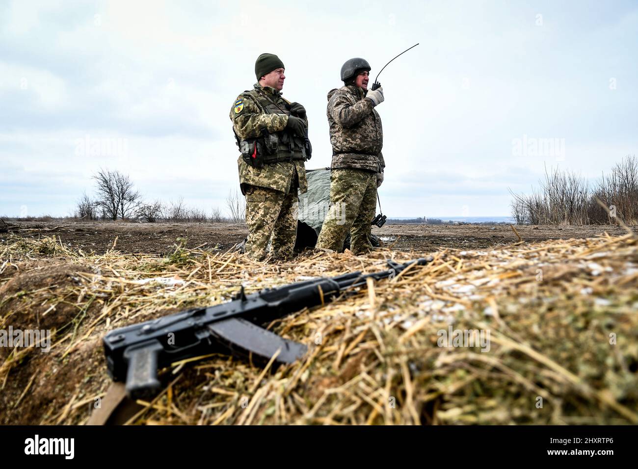 ZAPORIZHZHIA REGION, UKRAINE - MARCH 11, 2022 - Two men in camouflage ...