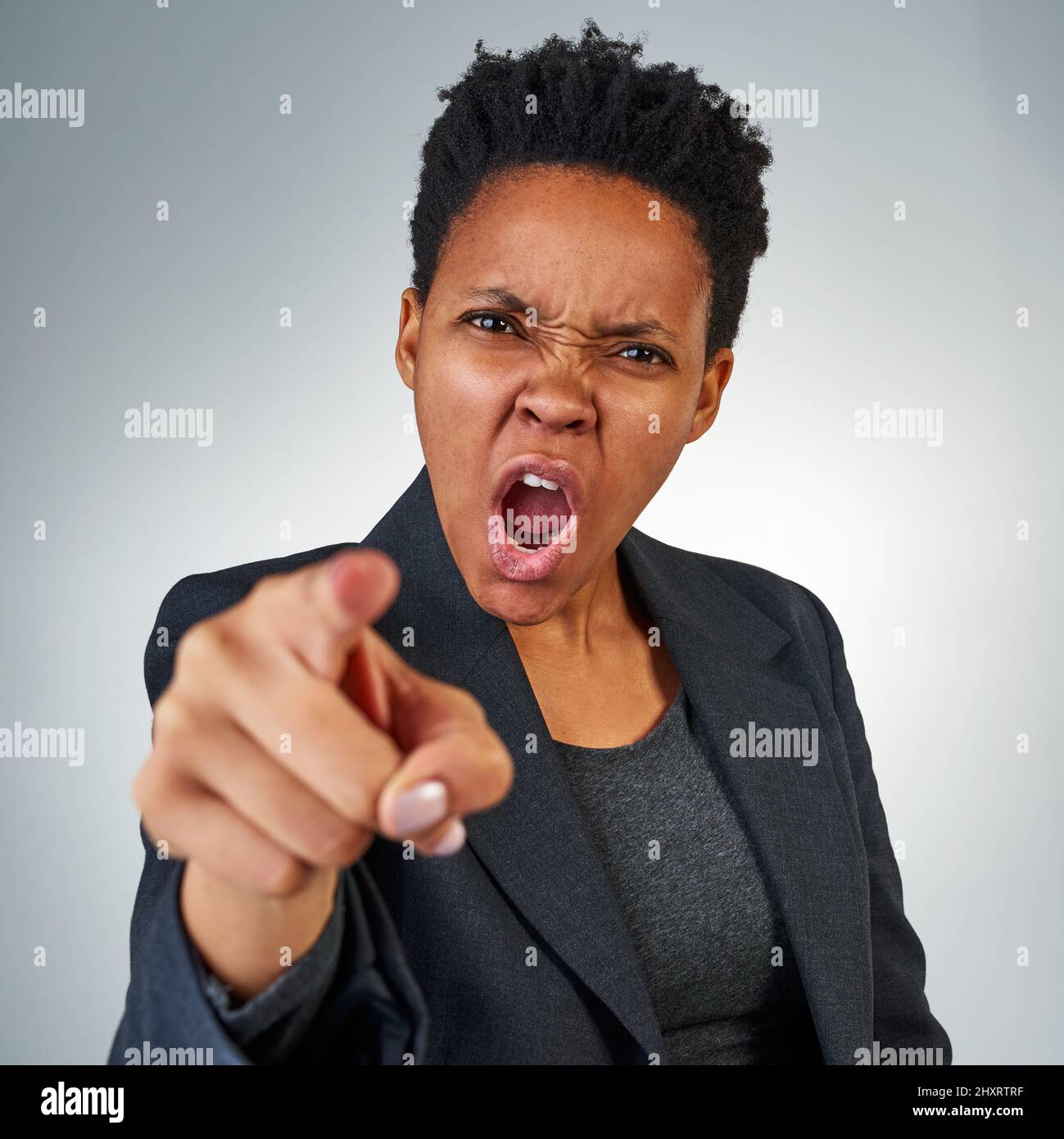 Its all your fault. Portrait of a furious businesswoman yelling and ...