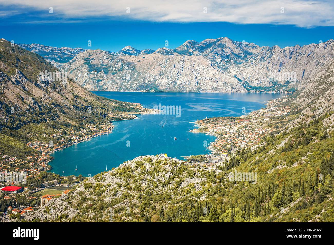 Sea coastline, view to the city surrounded by mountains. Kotor ...
