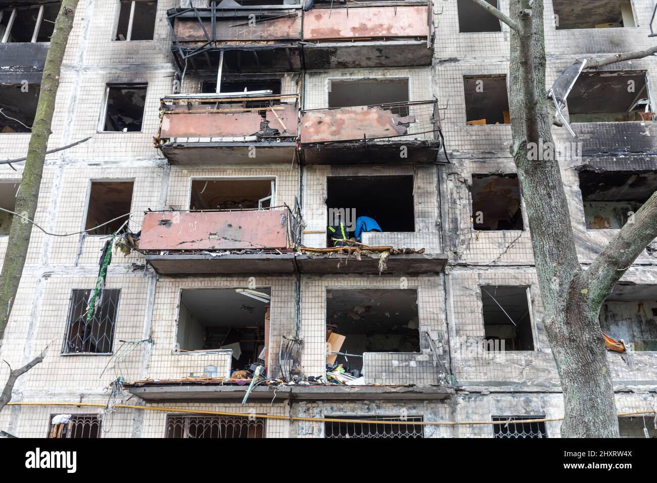 General view of a badly damaged residential building that was hit by a ...