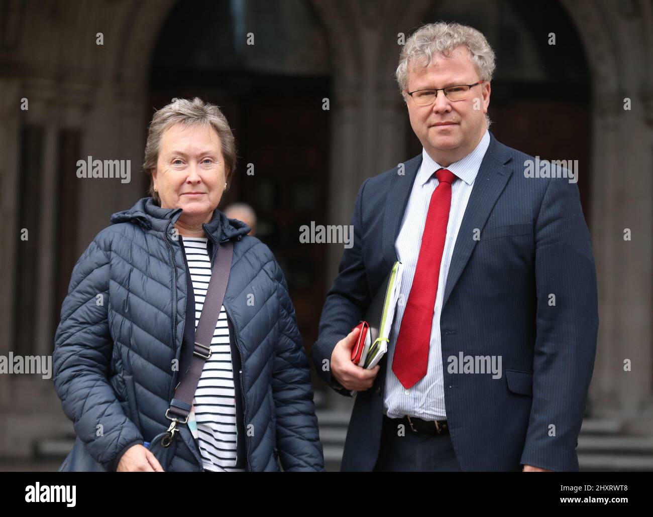 Cathy Gardner (left) and Paul Conrathe leave the High Court, London ...