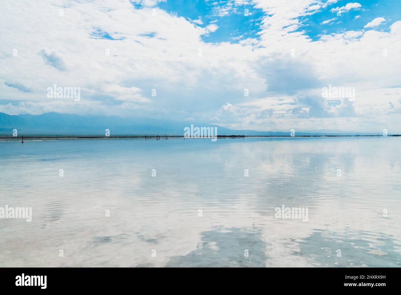 Reflections of the clouds in the clear water of the sea Stock Photo - Alamy