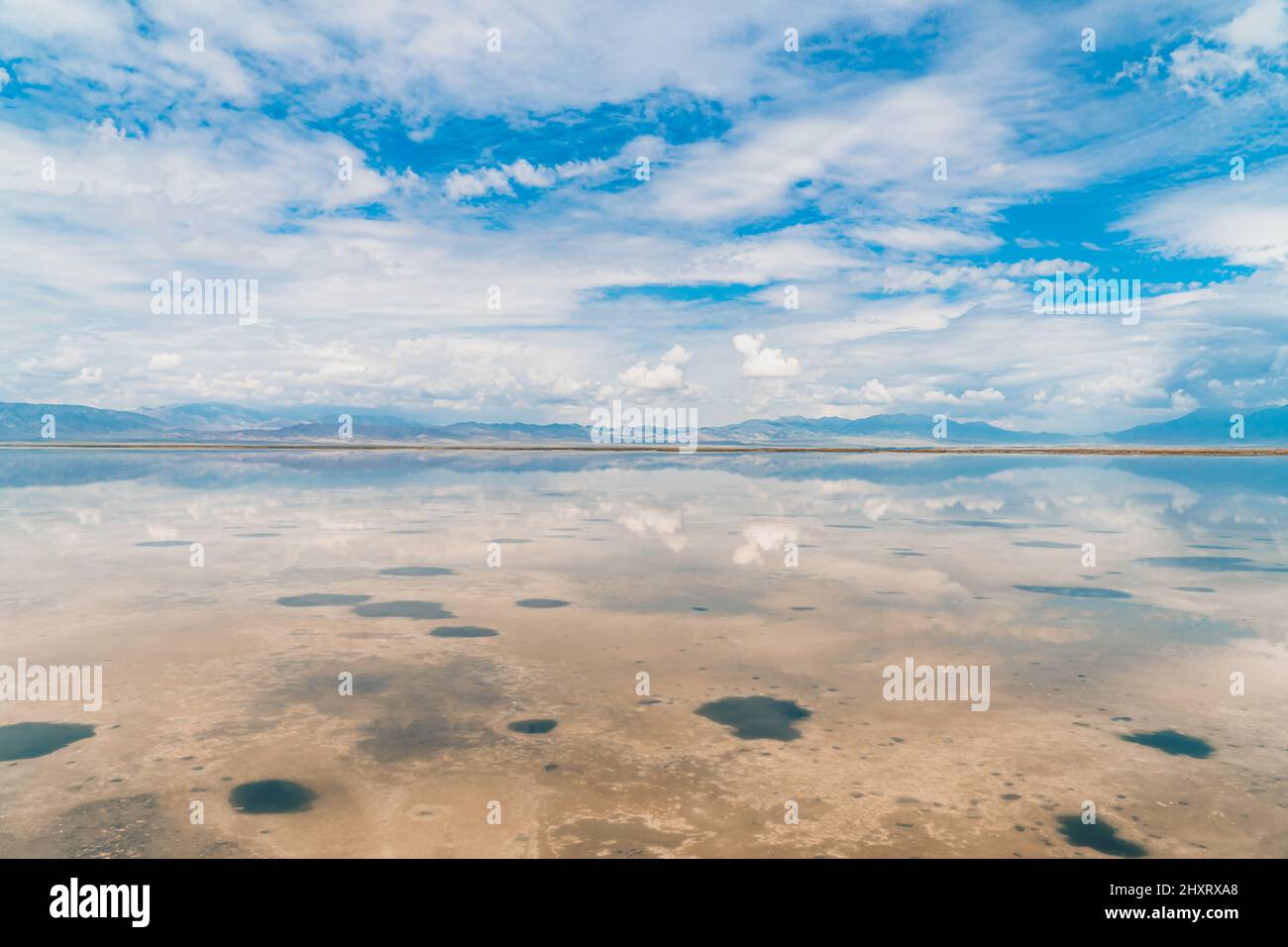 Reflections of the clouds in the clear water of the sea Stock Photo - Alamy