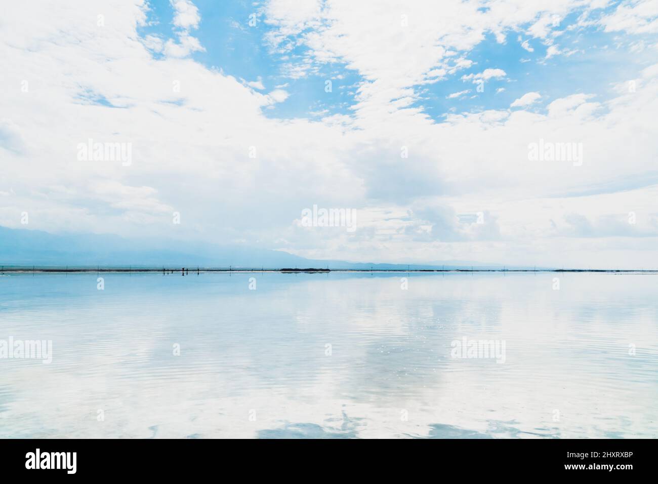Reflections of the clouds in the clear water of the sea Stock Photo - Alamy