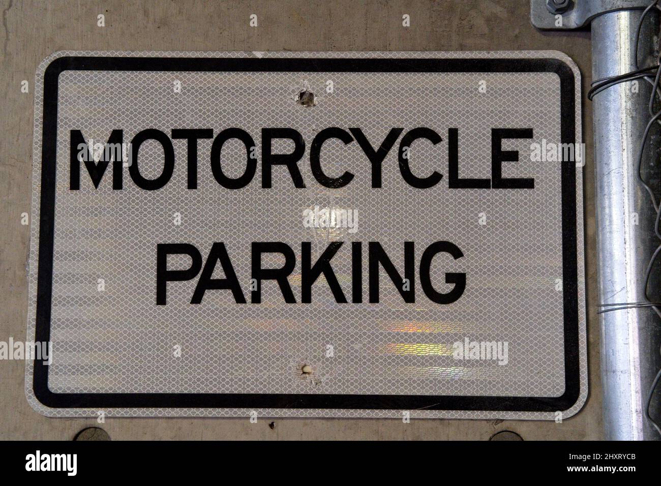 Closeup of a signage for "Motorcycle Parking" on a wall Stock Photo - Alamy