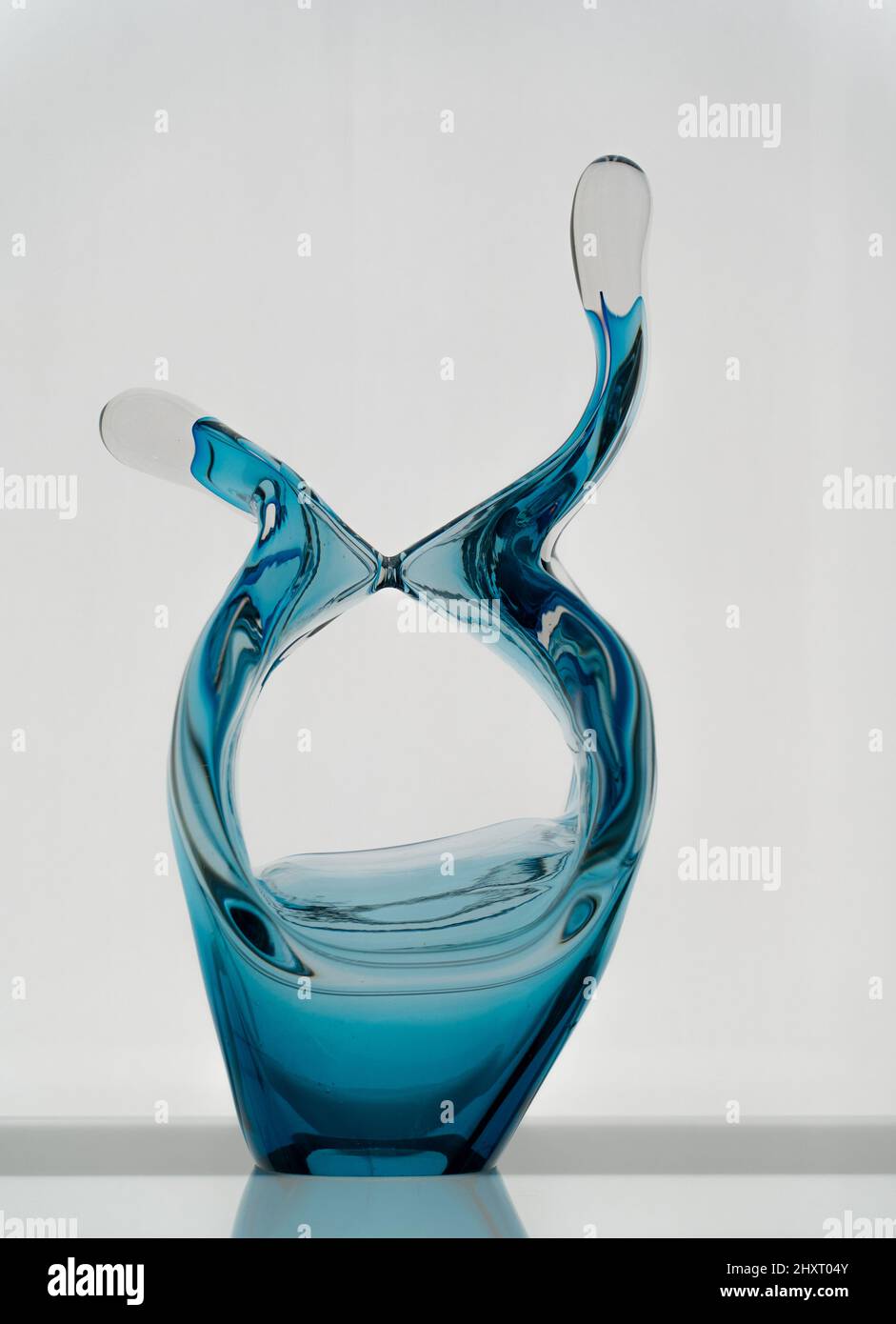 A Vintage Art Glass Trumpet Vase, Clear Glass Sculpture on a white ...