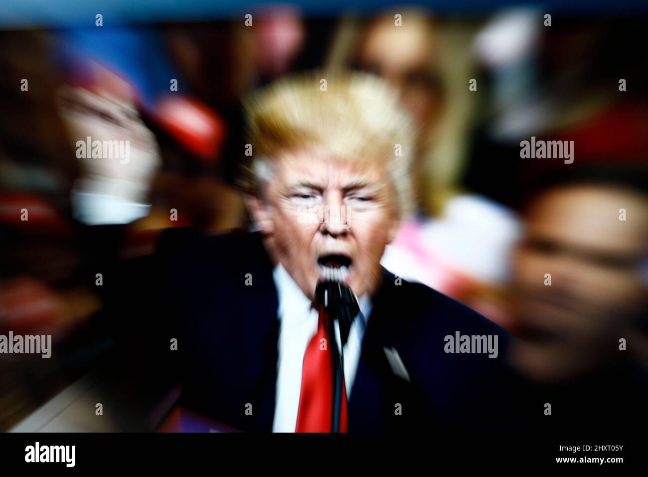 A slow shutter speed image of former US president Donald Trump on a TV ...