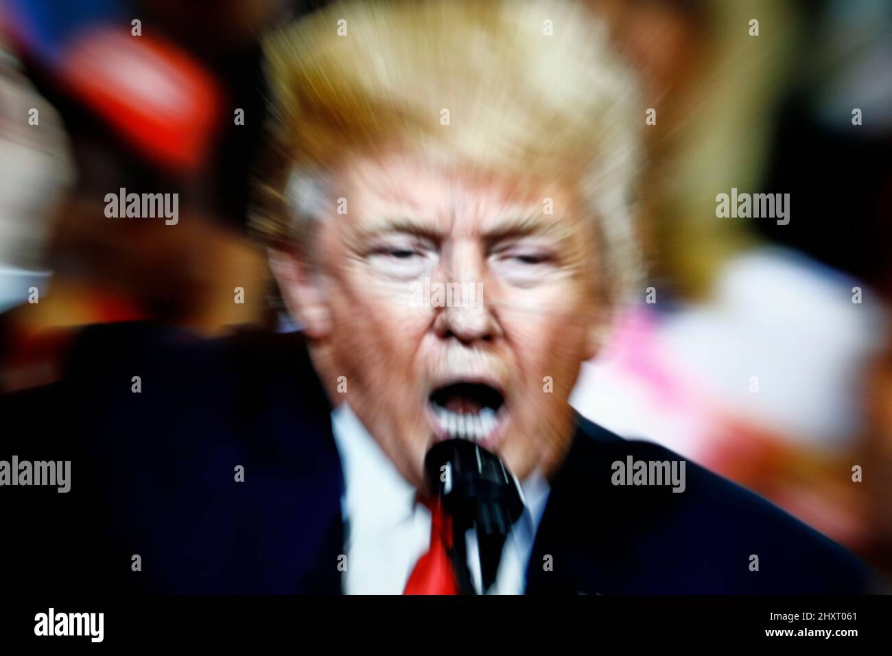 A slow shutter speed image of former US president Donald Trump on a TV ...
