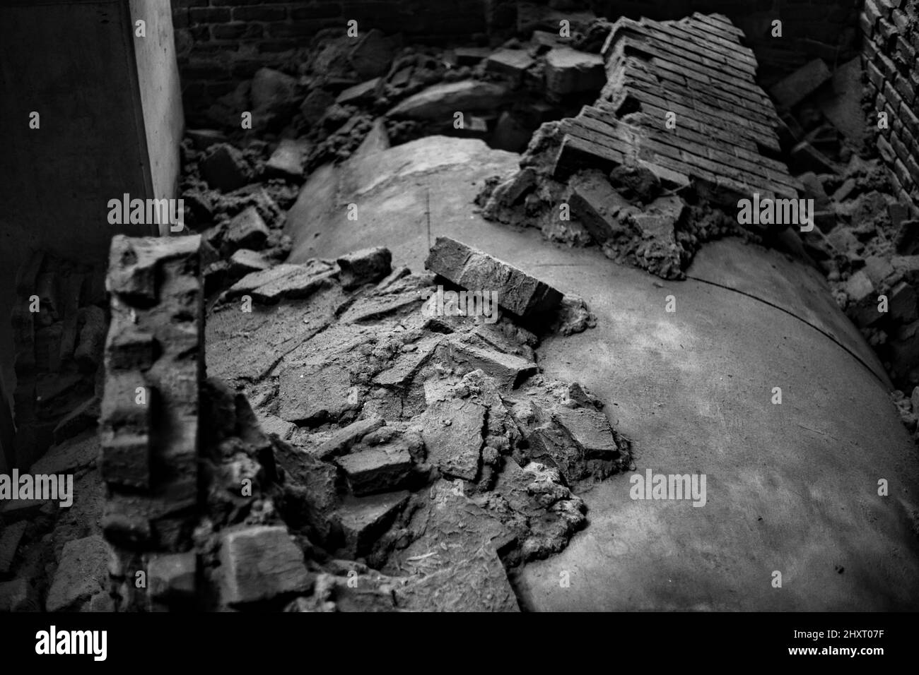 Grayscale of ruined brick wall in an industrial site Stock Photo - Alamy