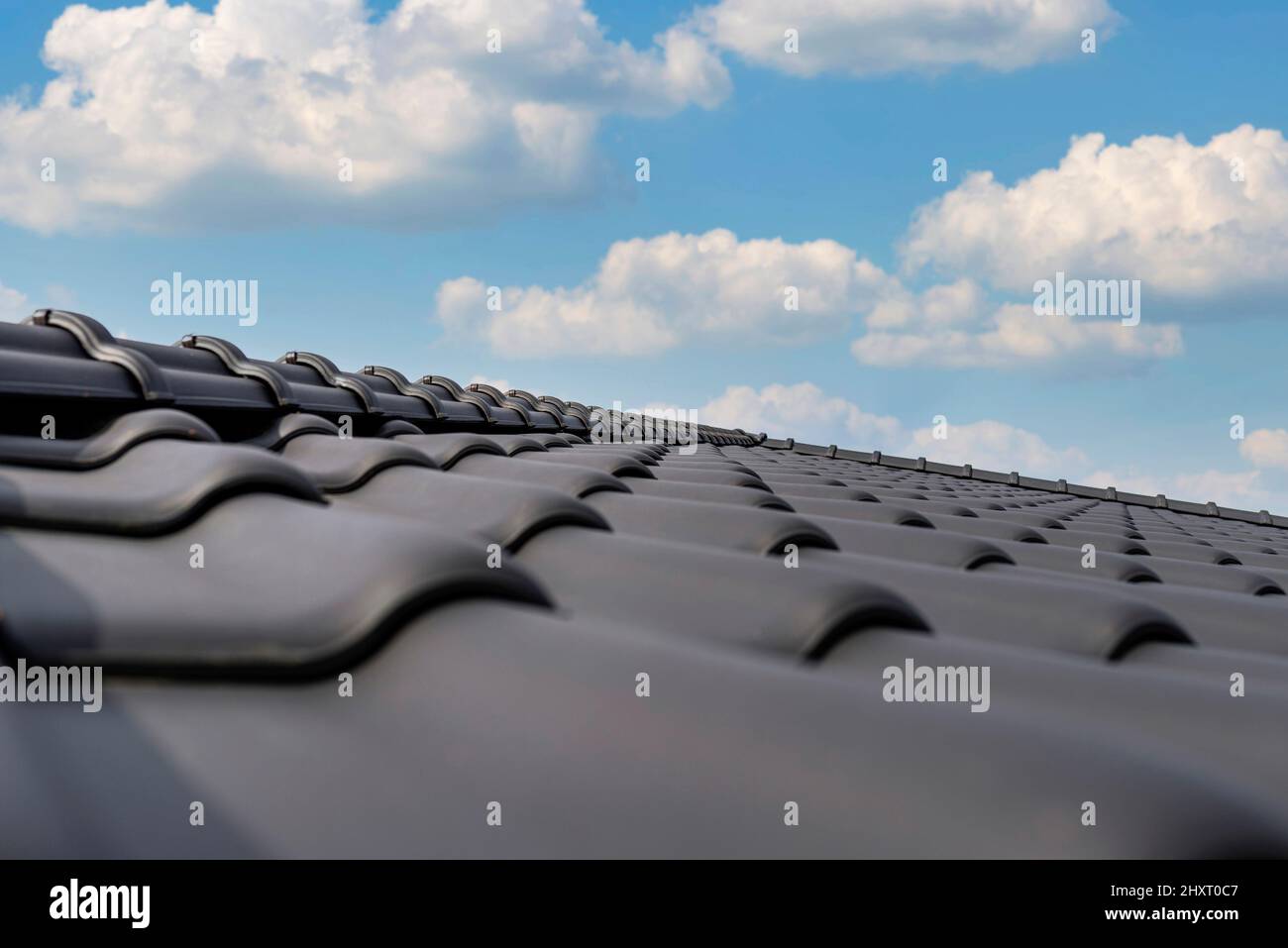 Ridge tile on the roof of a single-family house covered with a new ...