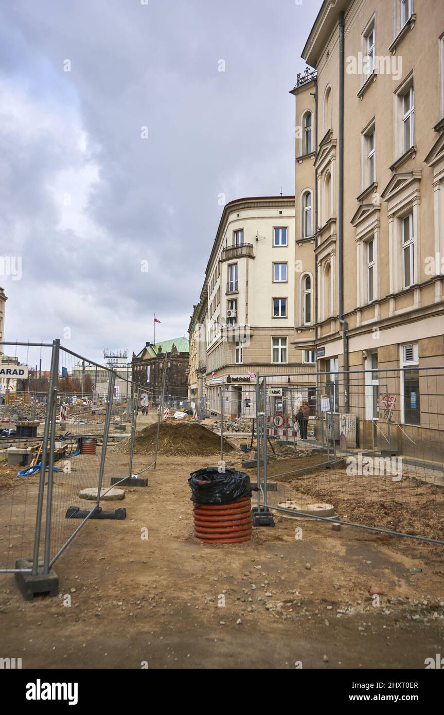 Construction area with street works between apartment buildings in the ...