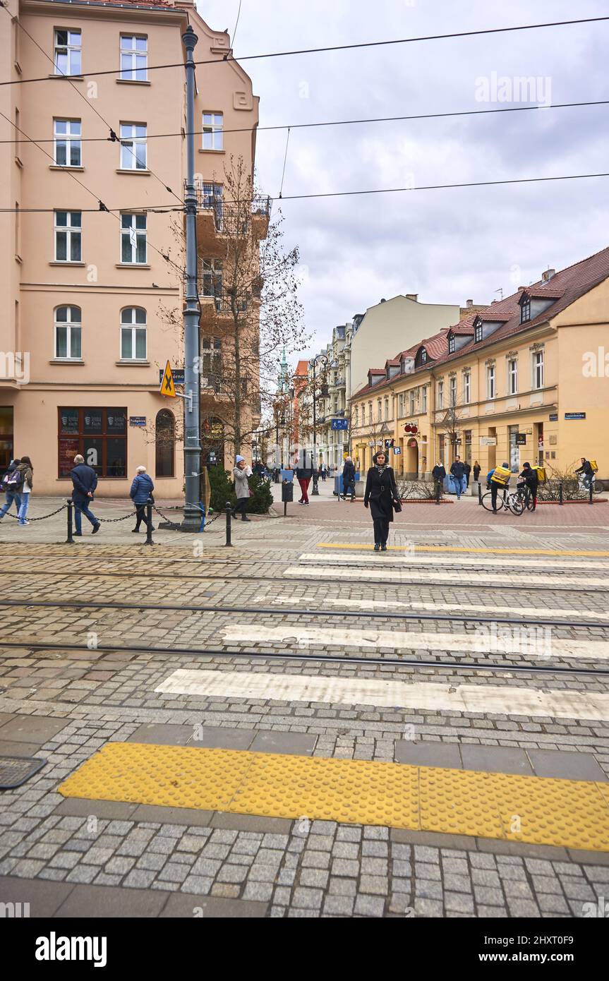 Zebra crossing with people near an apartment building on Wroclawska ...