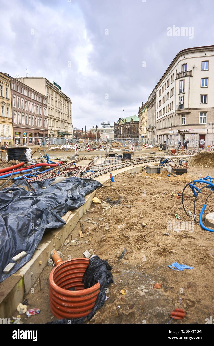 Construction area with street works between apartment buildings in the ...