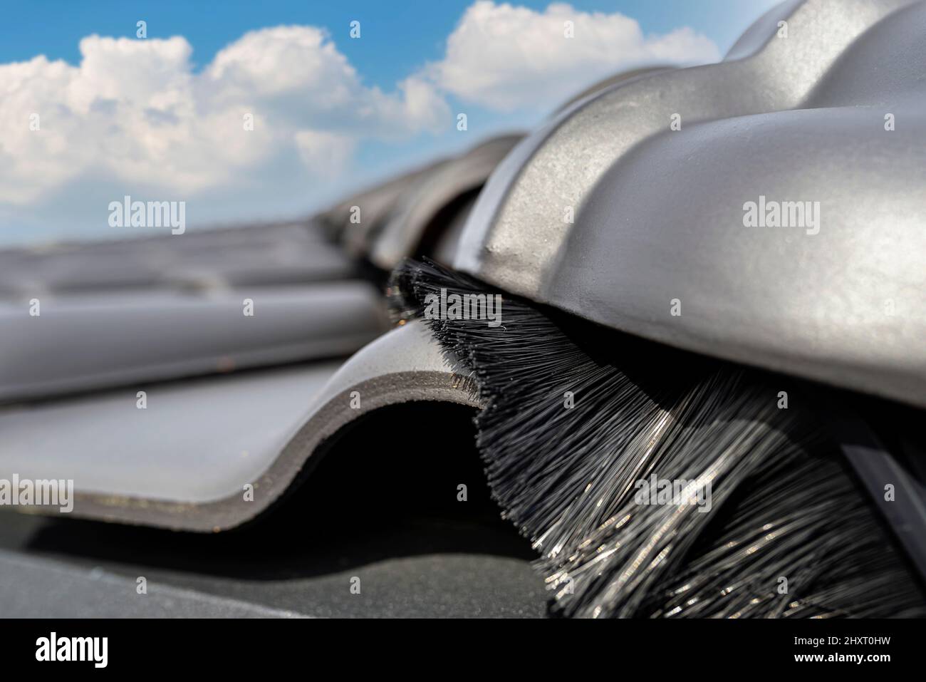Ridge tile on the roof of a single-family house covered with a new ...