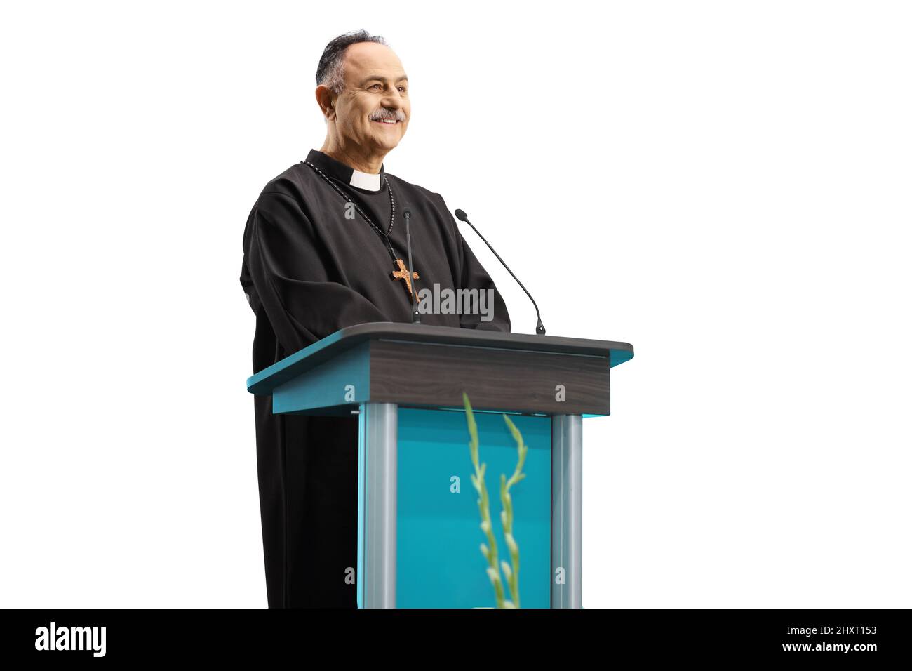 Mature priest giving a speech on a podium isolated on white background ...