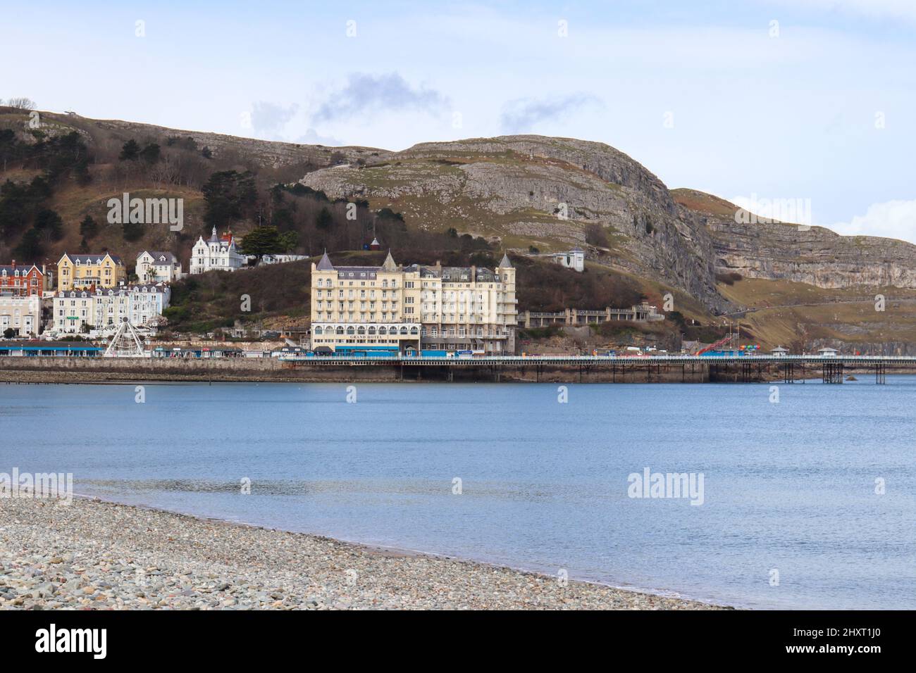 View of Llandudno Pier, the Grand Hotel and colourful houses on the ...