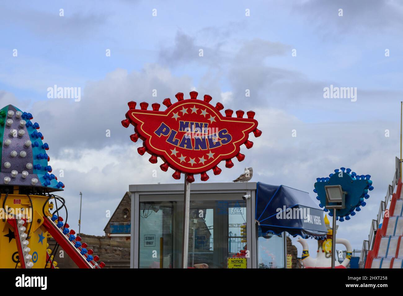Amusement rides on offer at Llandudno Pier Stock Photo - Alamy