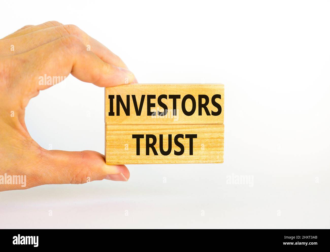 Investors trust symbol. Concept words Investors trust on wooden blocks ...