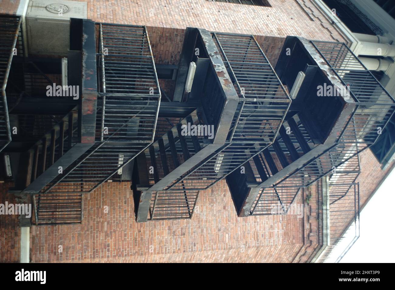 Vertical photo of outdoor emergency stairs of a building in Hong Kong ...
